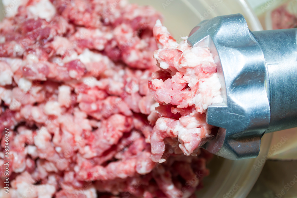 Minced meat and meat grinder. Twisted the meat into minced meat. Stock ...