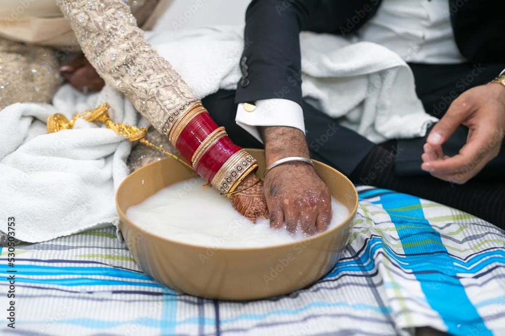 Indian Punjabi after wedding doli and pani varna ceremony hands close ...