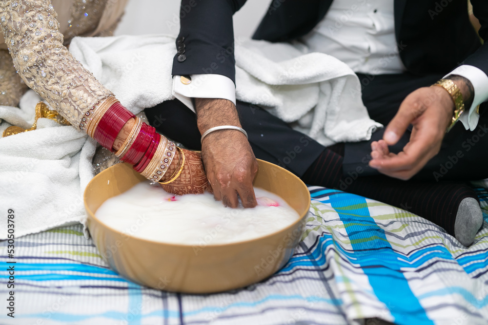 Indian Punjabi after wedding doli and pani varna ceremony hands close ...