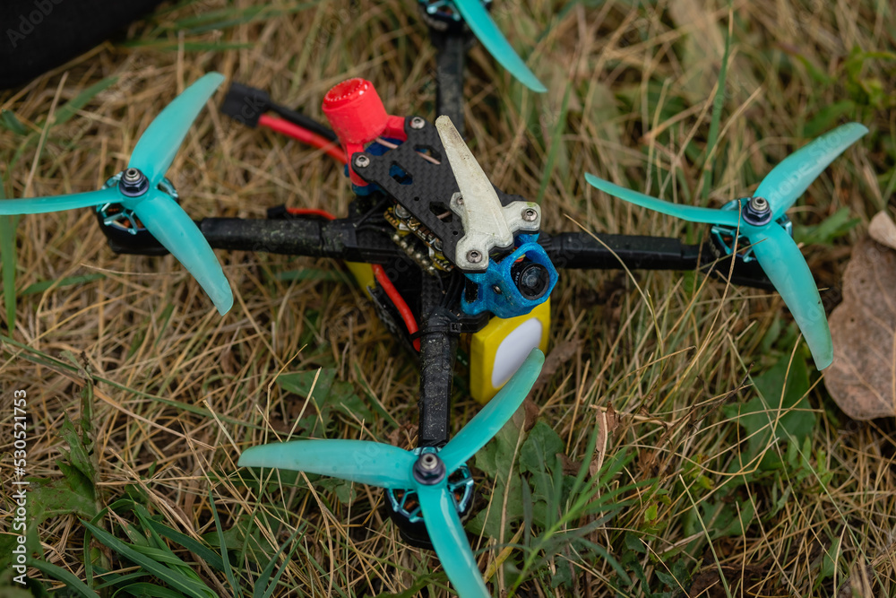 Sports FPV drone takes off quickly from grass in field. Stock Photo ...