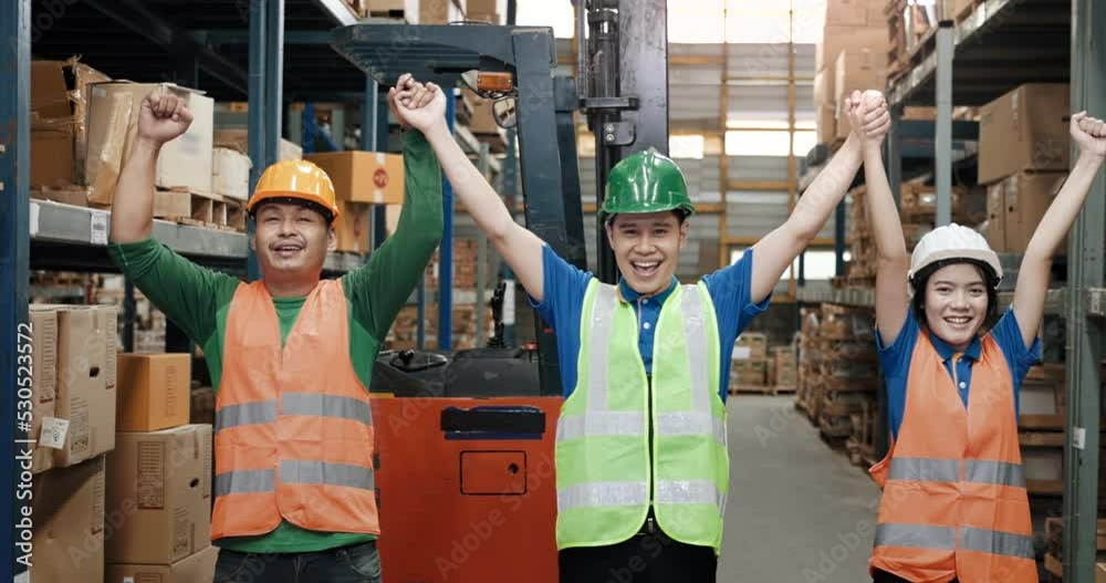 Team or group of people to congratulate, celebrating or happy in warehouse. Concept for teamwork ...