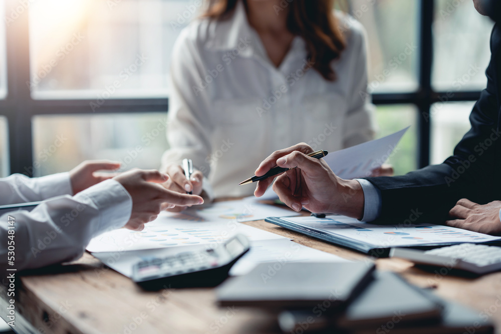 Business people meeting and calculating profit and loss The balance ...