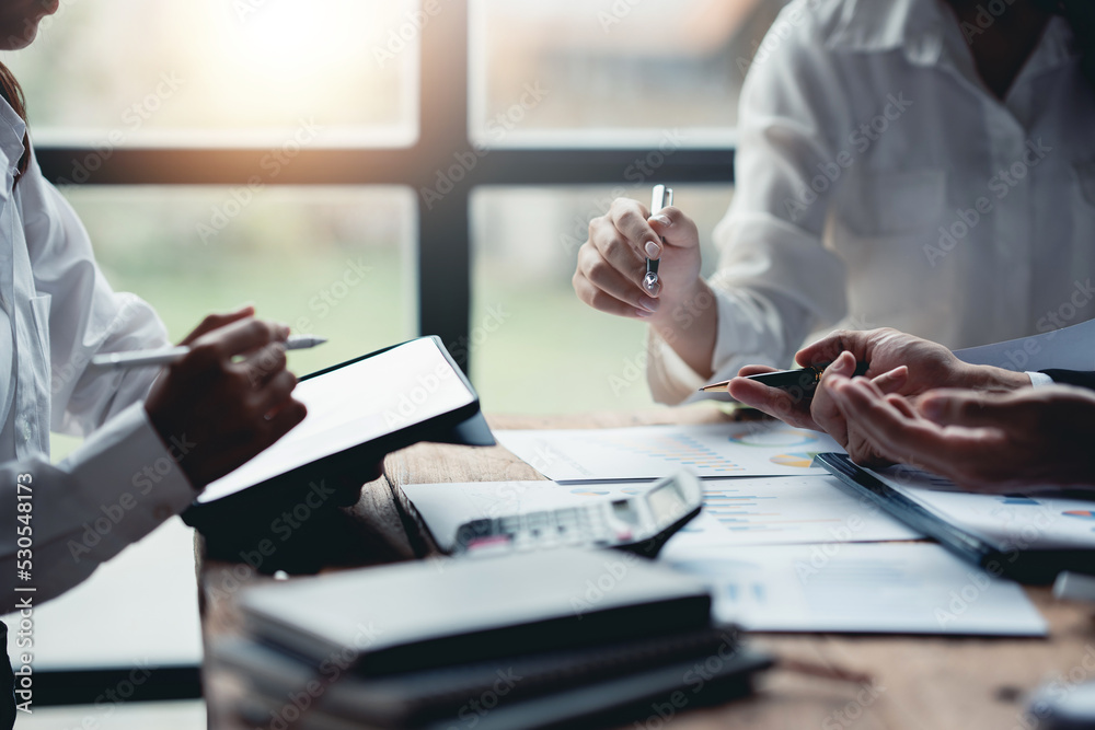 Business people meeting and calculating profit and loss The balance ...