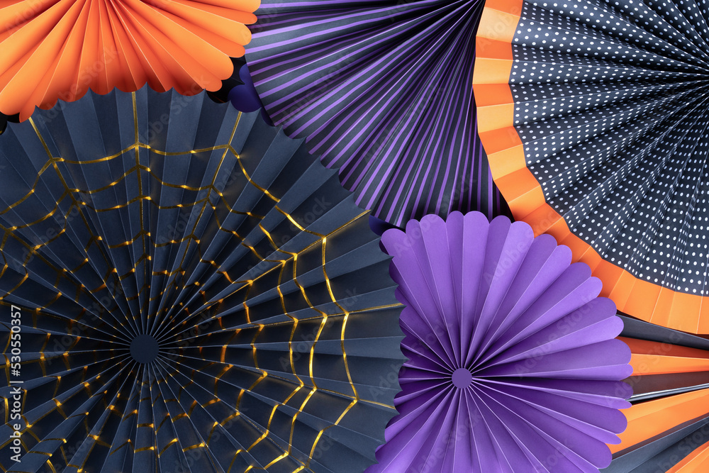 Colorful Halloween background from round paper fans. Various paper fans ...