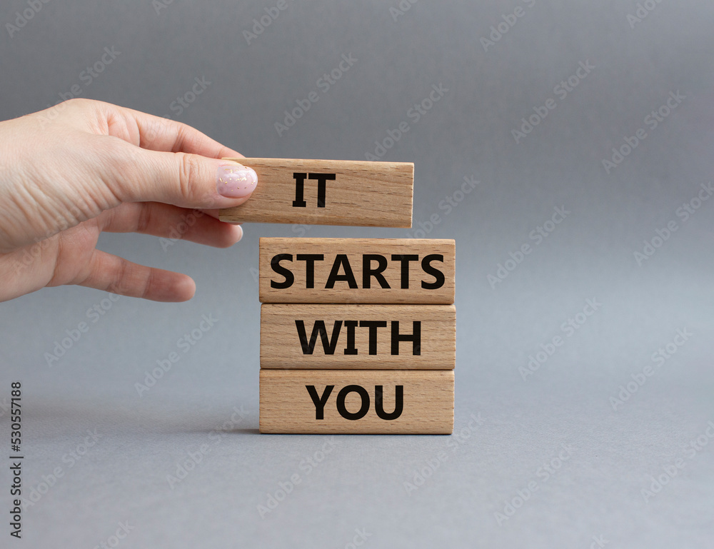 It starts with you symbol. Wooden blocks with words It starts with you ...