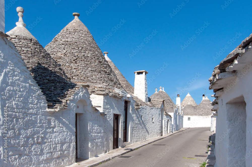 typical trulli houses in Alberobello, Puglia, Italy. Traditional ...
