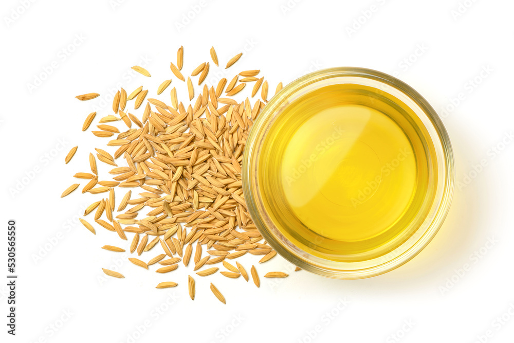 Top view of Rice bran oil with paddy rice isolated on white background ...