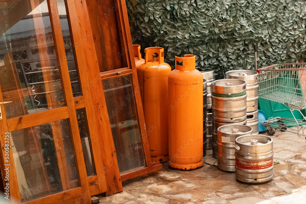 Orange gas cylinders are on the street, Large gas cylinders. Flammable ...