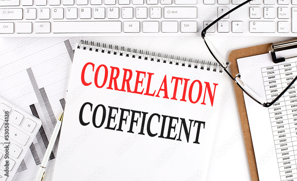 Text CORRELATION COEFFICIENT on Office desk table with keyboard ...