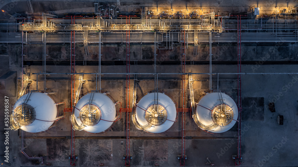 Aerial view spherical tanks for petrochemical plant at night ...