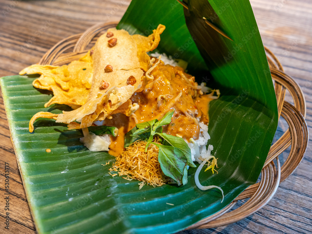 A traditional Nasi Pecel of Indonesia, consisting of steamed rice with ...