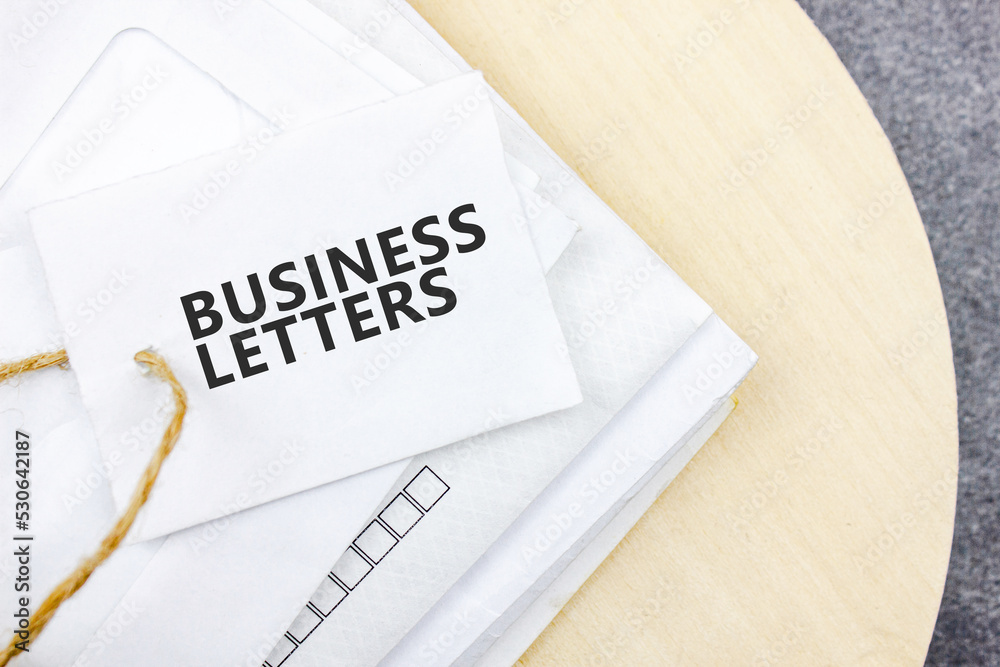 Paper envelopes and a note with the words BUSINESS LETTERS. Delivery of ...