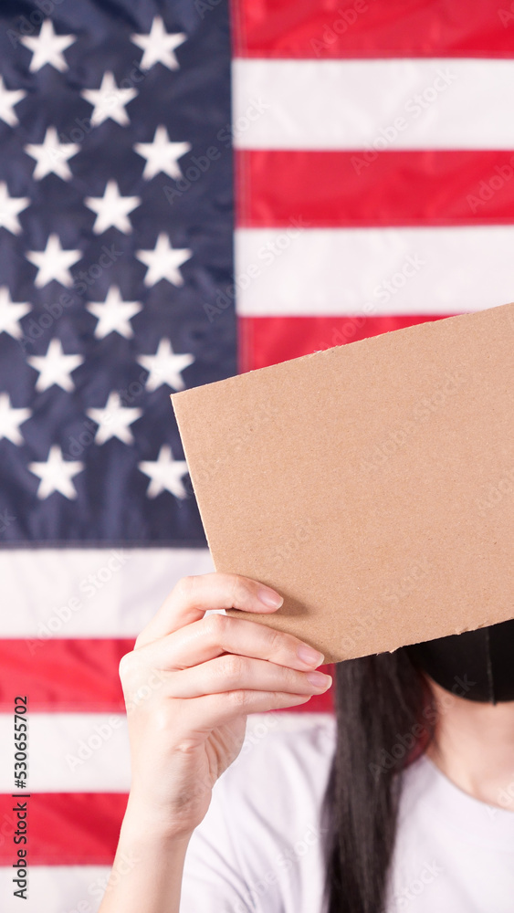 Unrecognizable woman showing empty cardboard banner. Hands holding ...