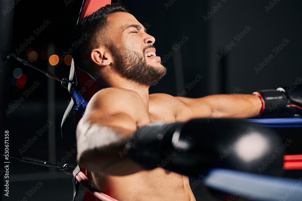 Boxing, pain and tired boxer in the ring fighting in a sports arena or ...