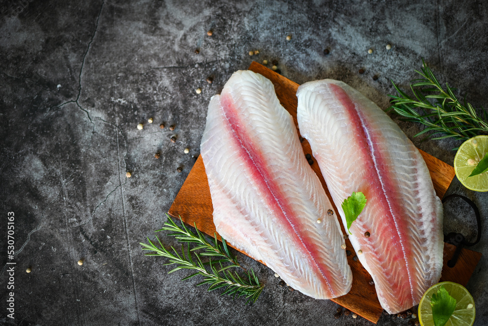 fish fillet on wooden board with ingredients for cooking, meat dolly ...