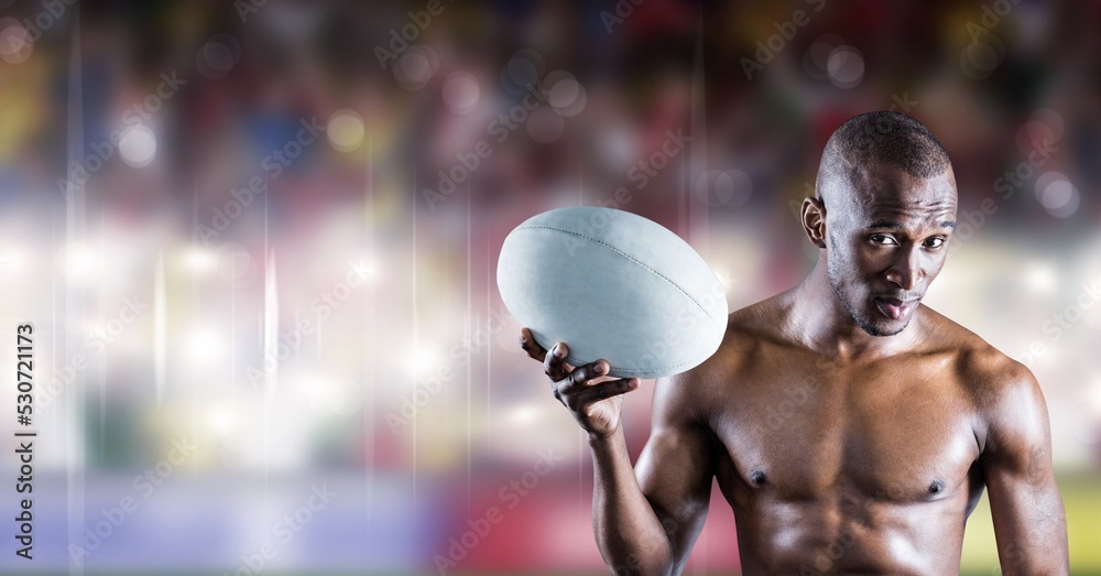 Foto de Composition of shirtless male rugby player holding rugby ball ...