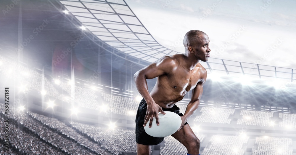 Composition of shirtless male rugby player holding rugby ball over ...
