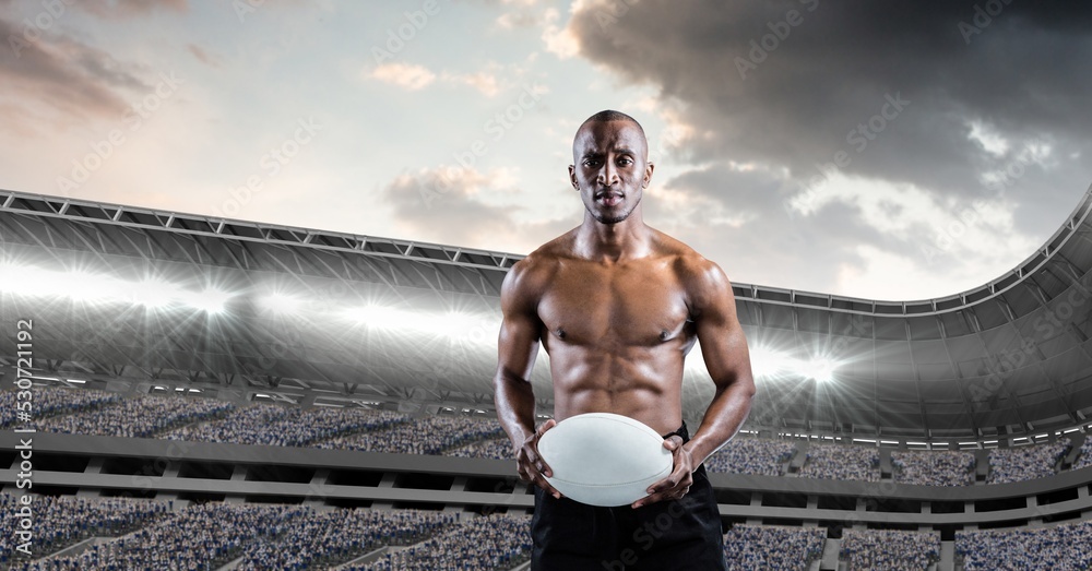 Foto de Composition of shirtless male rugby player holding rugby ball ...