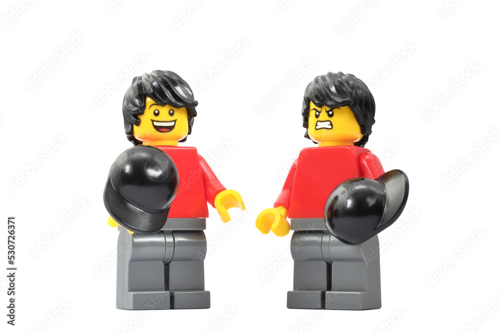 Lego minifigures red torso and black cap smiling and angry. Editorial ...