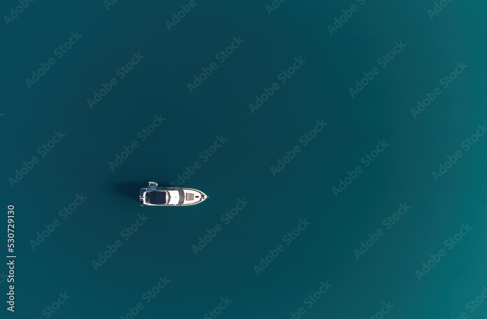 Aerial yacht on calm sea. Luxury cruise trip. View from above of white ...