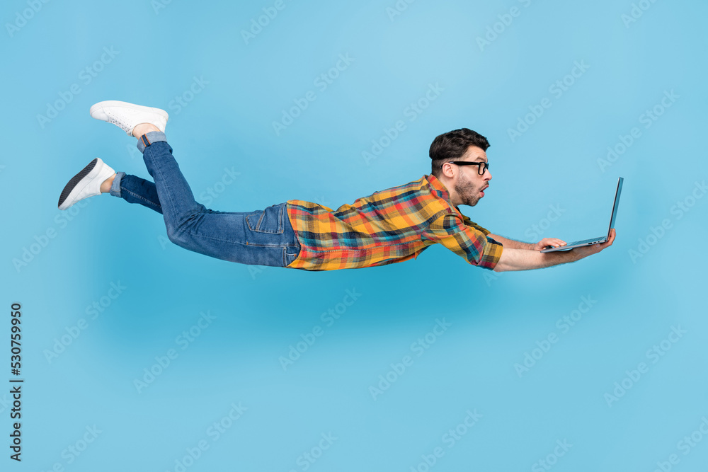 Full length profile photo of impressed person flying fall use netbook ...