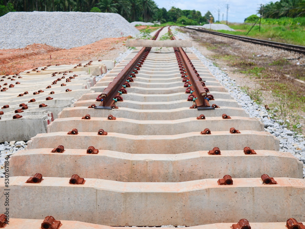 Construction of railway tracks. Railway sleepers are made of concrete ...
