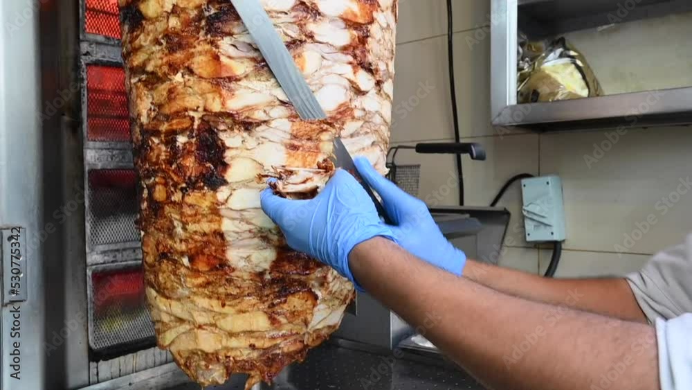 4k: Chef cutting the meat, Preparation of chicken shawarma sandwich ...