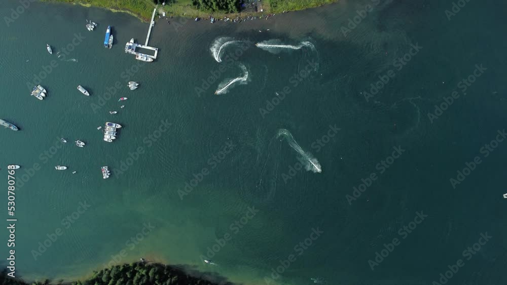 4k Top view of boats move on water in open air bay irrl. Aerial view of ...