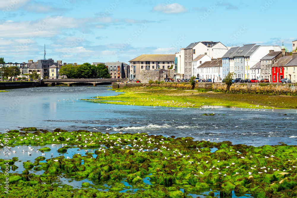 River Corrib at low water level and tide on a warm sunny day. The Long ...