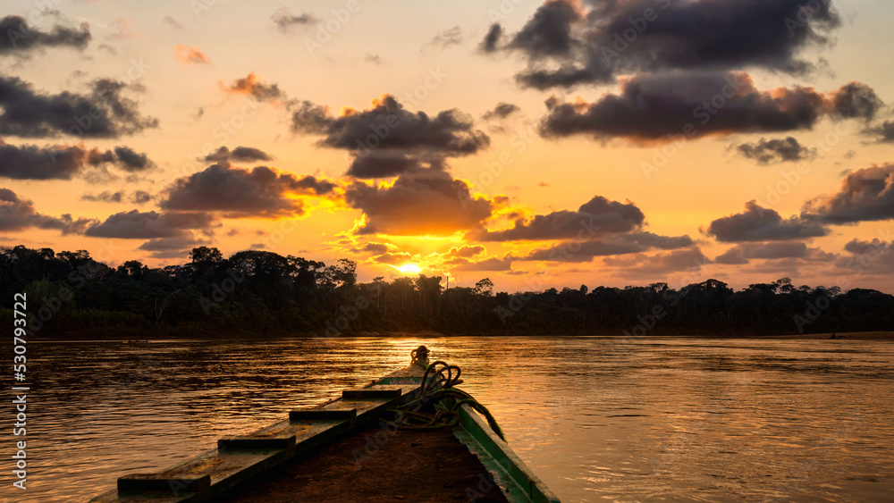 Tambobata River surrounded by Peruvian rainforest at sun set, Tambopata ...