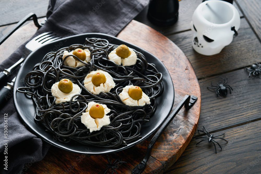 Halloween party Italian black pasta decorated horror olives like eyes ...