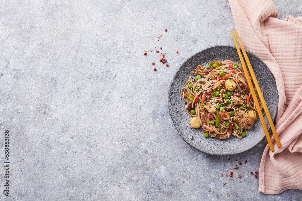 Wok with turkey meat, soba noodles, corn, green peas, green beans and ...