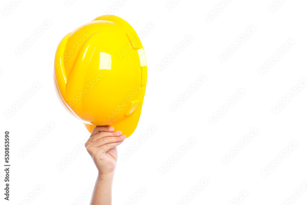 Human Hand holding yellow hard hats, Isolated on White Background ...