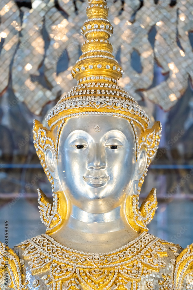 Deity statue standing straight made of silver, wearing silver gold ...