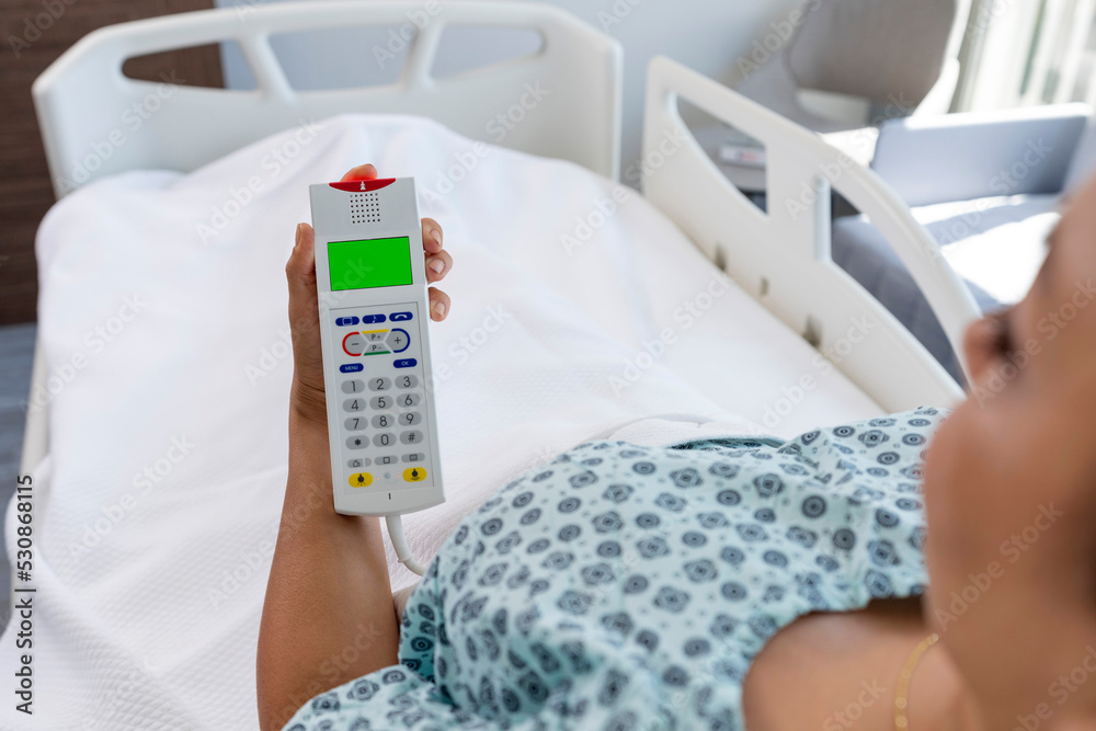 Nurse call button in patient room in modern hospital. Hand pushing ...