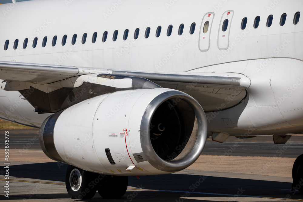 Engine and fuselage of a famous commercial bi-engine jet passenger ...