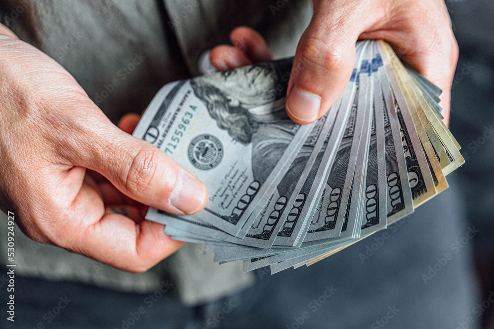 money in hand Stock Photo | Adobe Stock