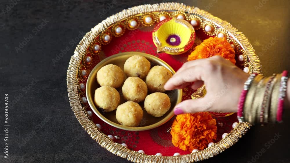 Women taking Diwali sweets Laddu or ladoo Jalebi peda Indian sweet ...