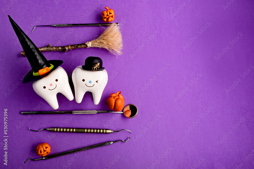 dental concept. figurines of teeth in halloween costumes and dental ...