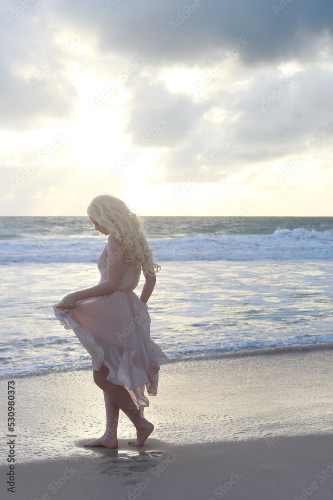 full length portrait of beautiful young woman with long hair wearing ...