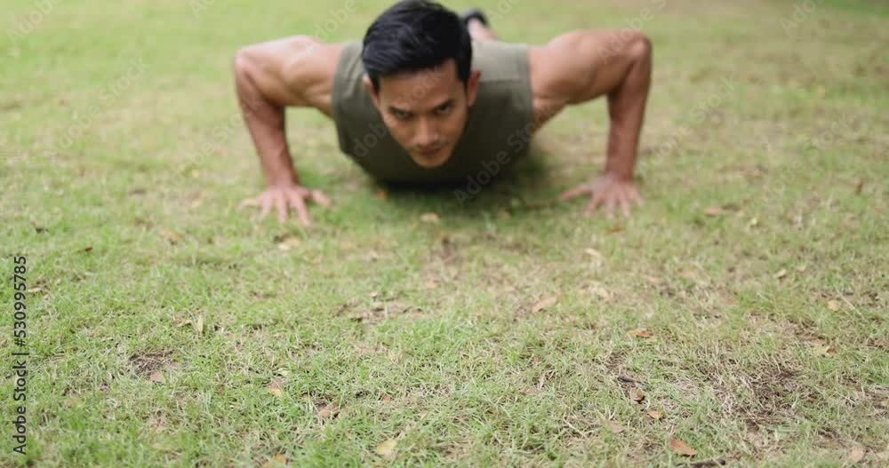 4K video Asian young man push up together in green park. Concept for ...