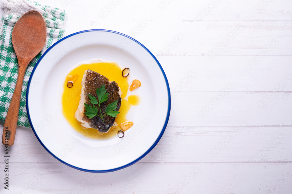 Bacalao al pil pil traditional tapa from the north of Spain. Coconut ...