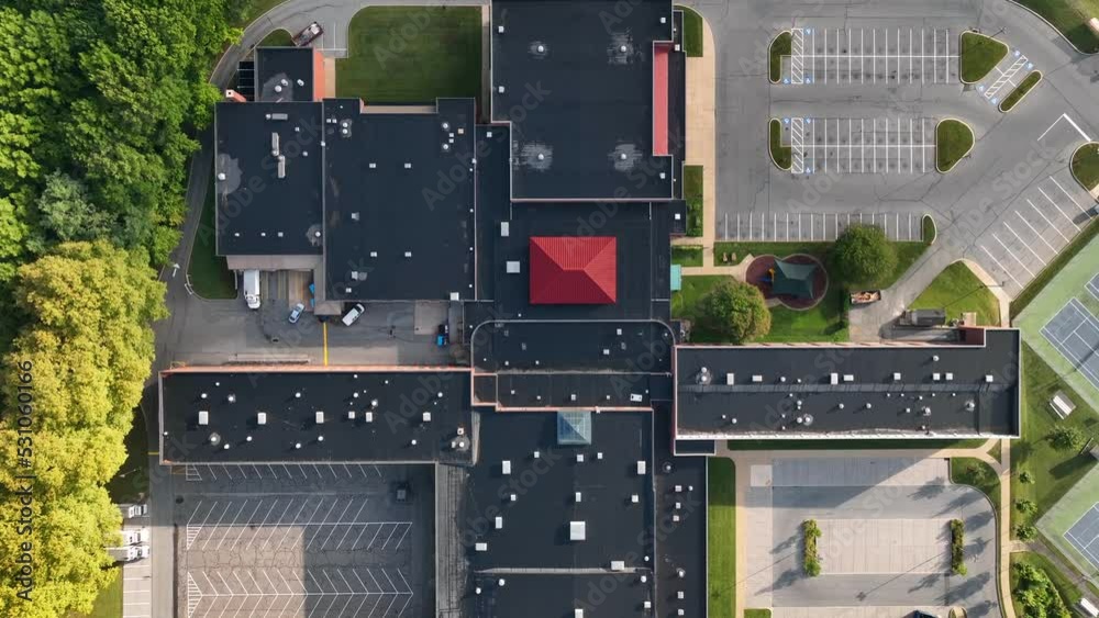 Top down aerial view of large school building. American high school ...