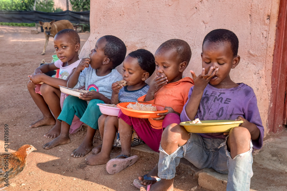 african kids eating Stock Photo | Adobe Stock