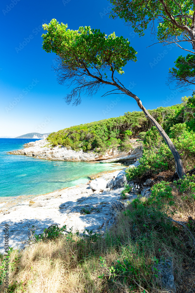 Clear sky over the pristine water of Ionian Sea washing the idyllic ...