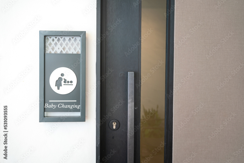 Baby changing toilet icon symbol in front of the toilet door. Sign and ...