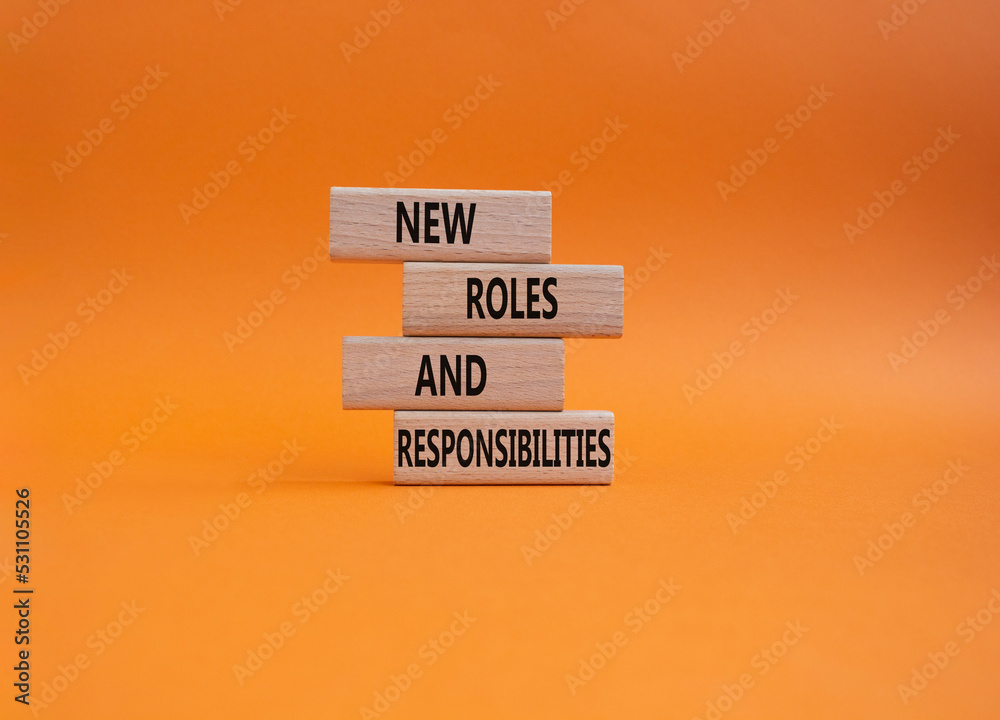 New roles and responsibilities symbol. Wooden blocks with words New ...