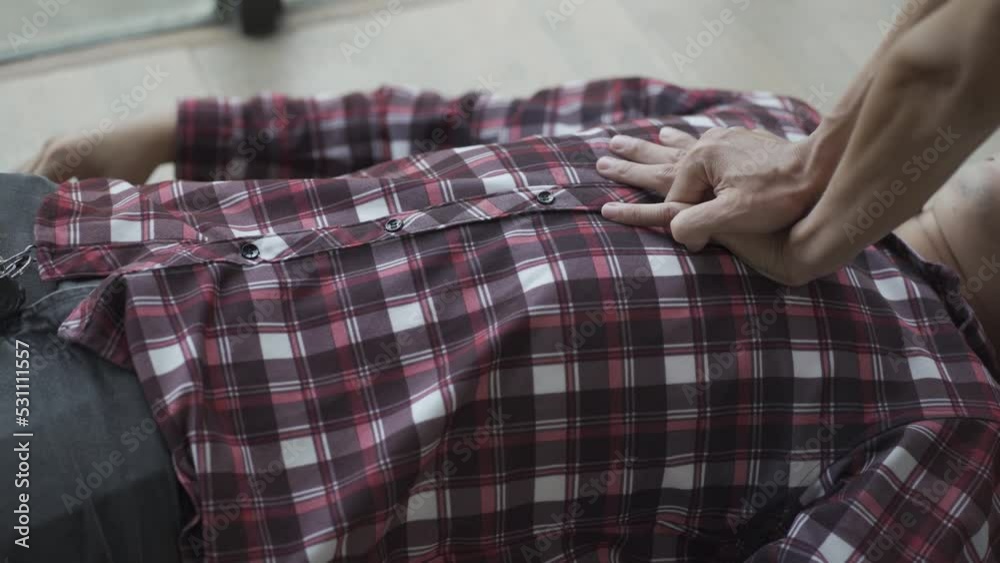 An office woman uses a hand pump to deliver chest compressions for ...