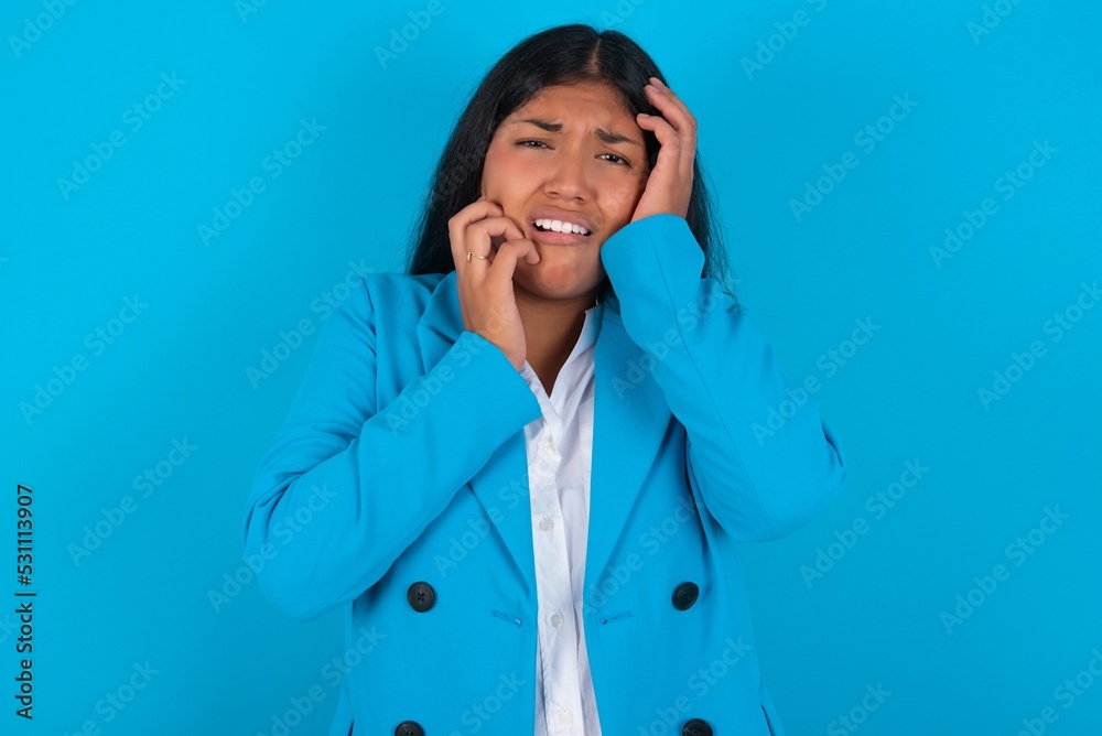 Doleful desperate crying Young latin woman wearing blue blazer blue ...
