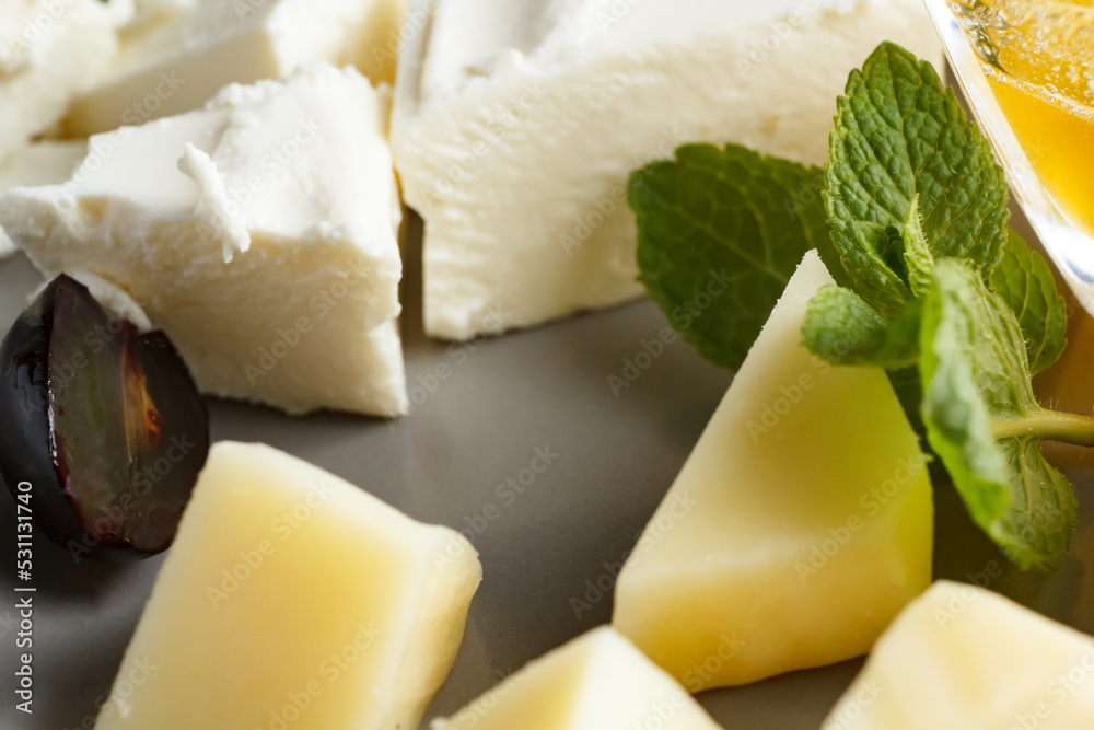 four types of cheese, feta, gorgonzola, parmesan, hard cheese, with ...